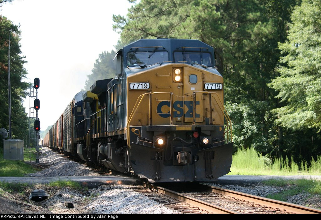 CSX C40-8W's 7719 and 7396 roll across the Wilkes Grove Church Rd grade crossing